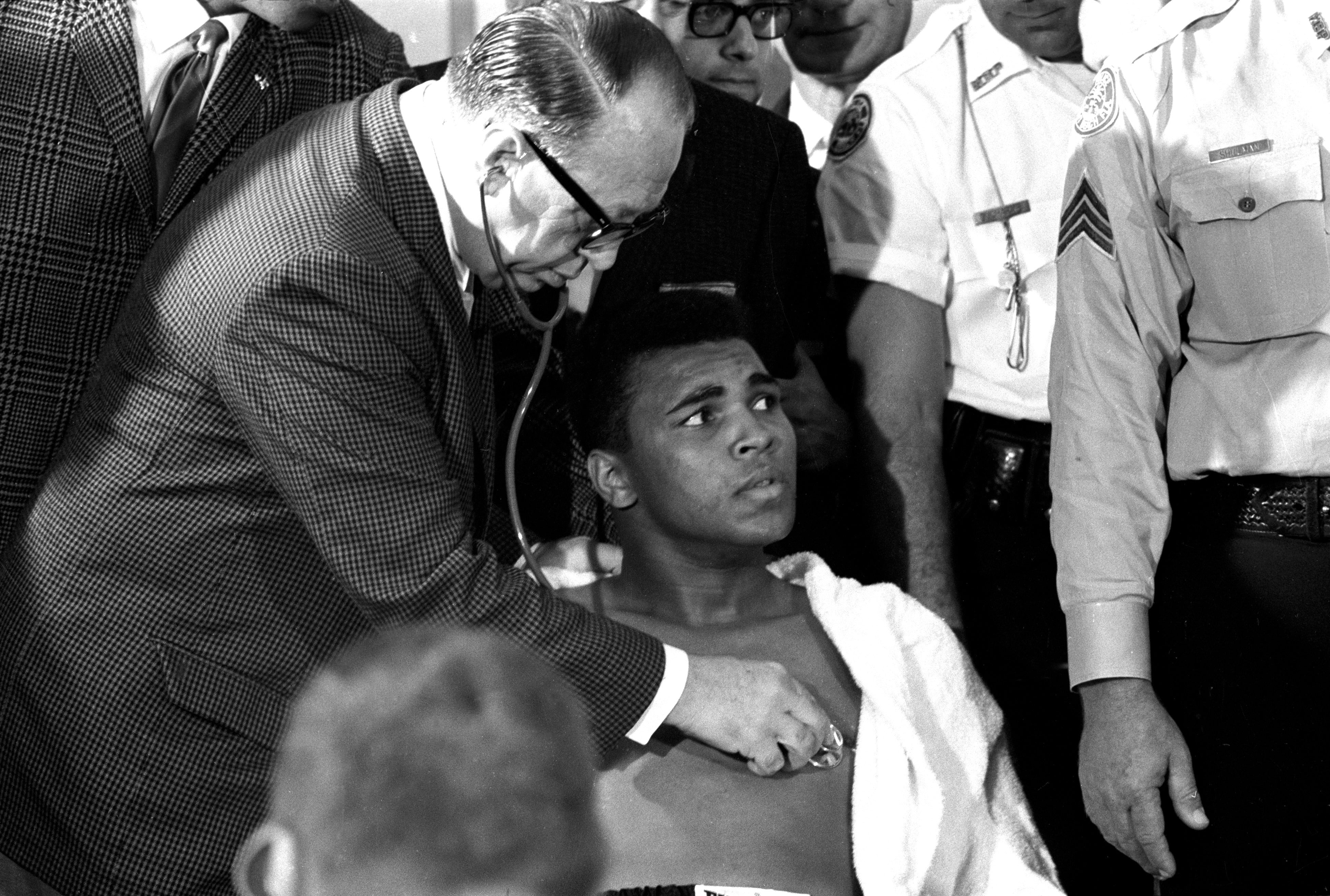 Ali vs Liston I, Weigh-In, Ali with Doctor | Neil Leifer Photography
